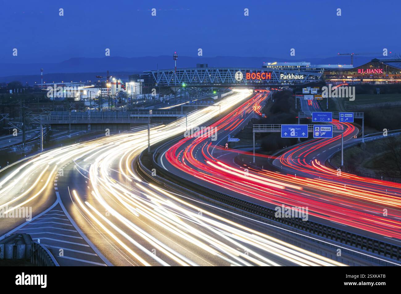 A8 motorway at Stuttgart Airport in the evening. Heavy traffic, lanes ...