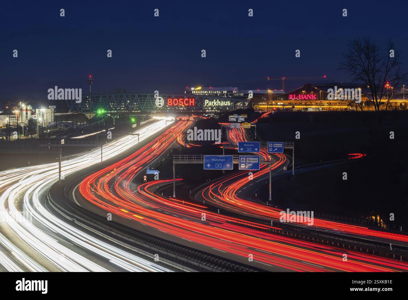 A8 motorway at Stuttgart Airport in the evening. Heavy traffic, lanes ...