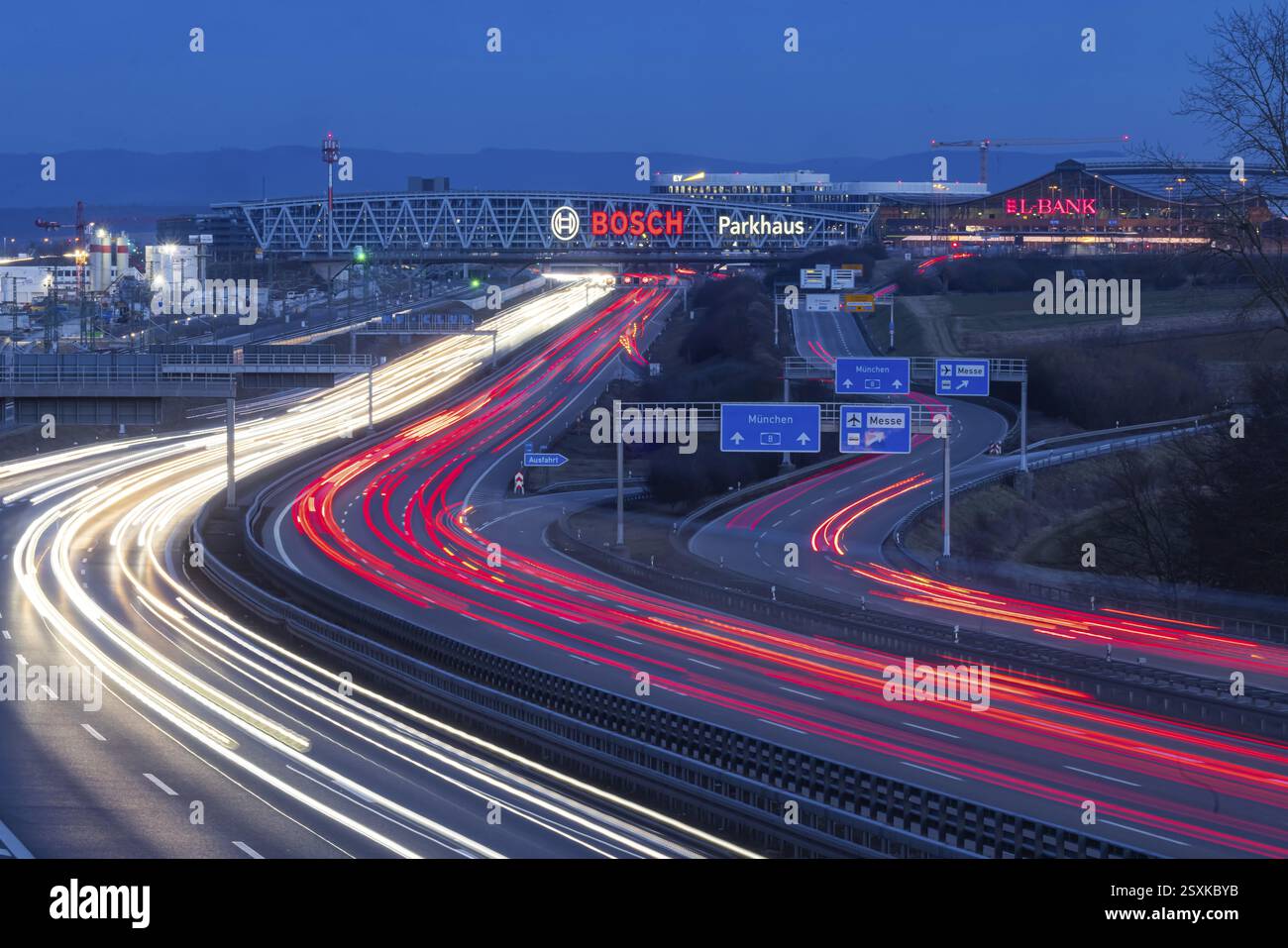 A8 motorway at Stuttgart Airport in the evening. Heavy traffic, lanes ...