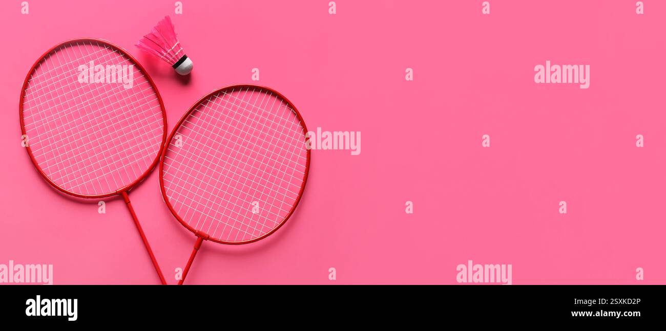 Badminton rackets and shuttlecock on pink background with space for ...