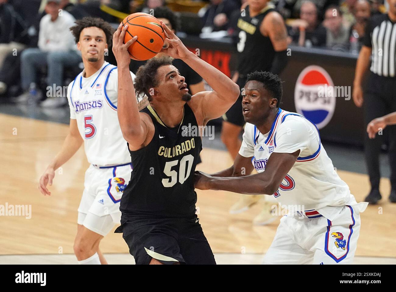 Colorado center Elijah Malone (50) goes up for a basket as Kansas ...