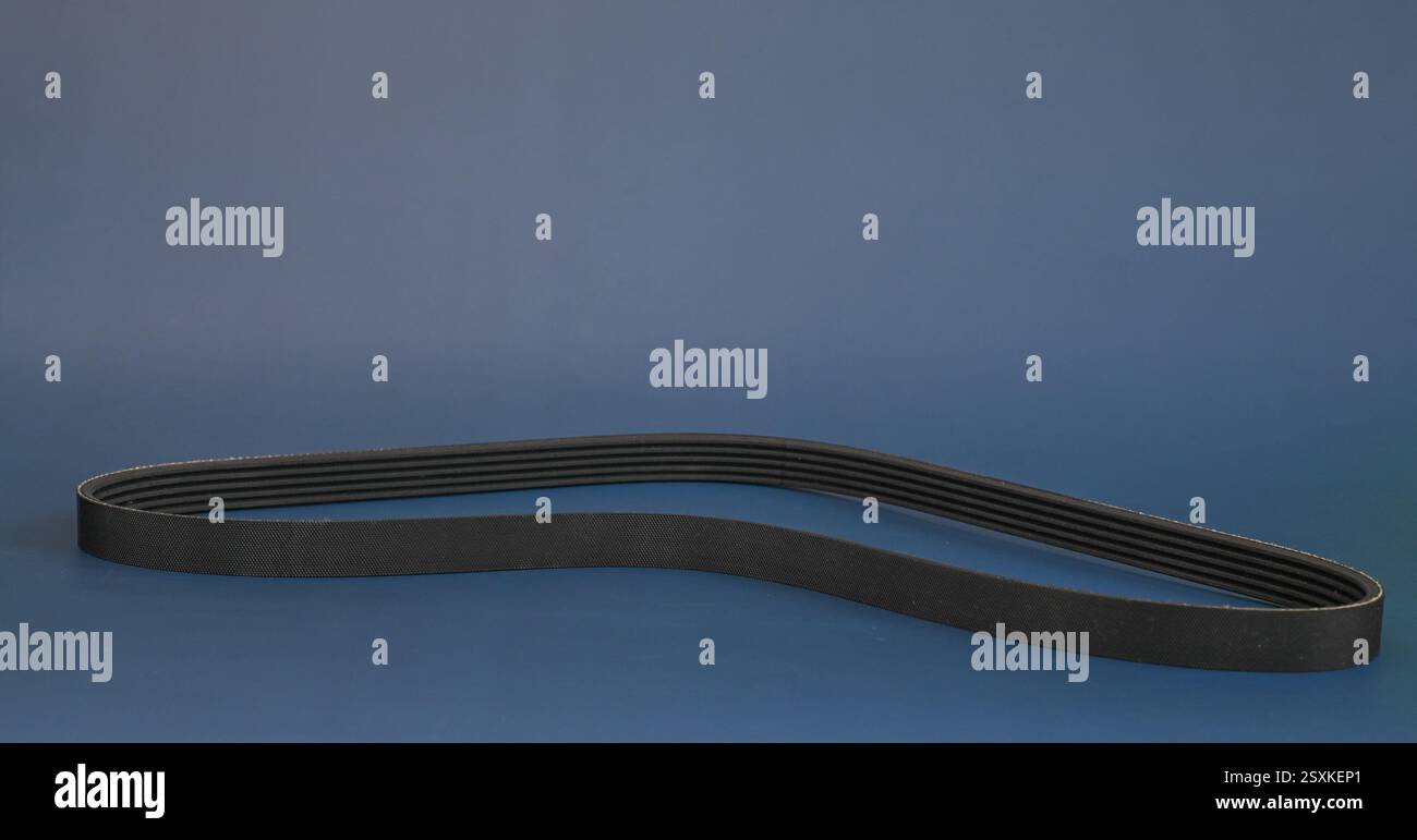 car's generator belt. spare parts on a blue background Stock Photo - Alamy