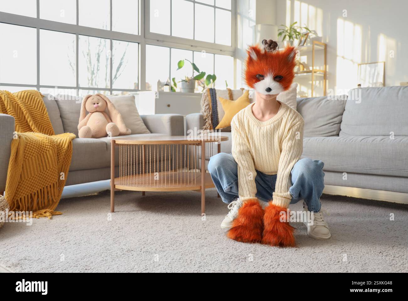 Quadrober girl in cat disguise playing at home Stock Photo - Alamy