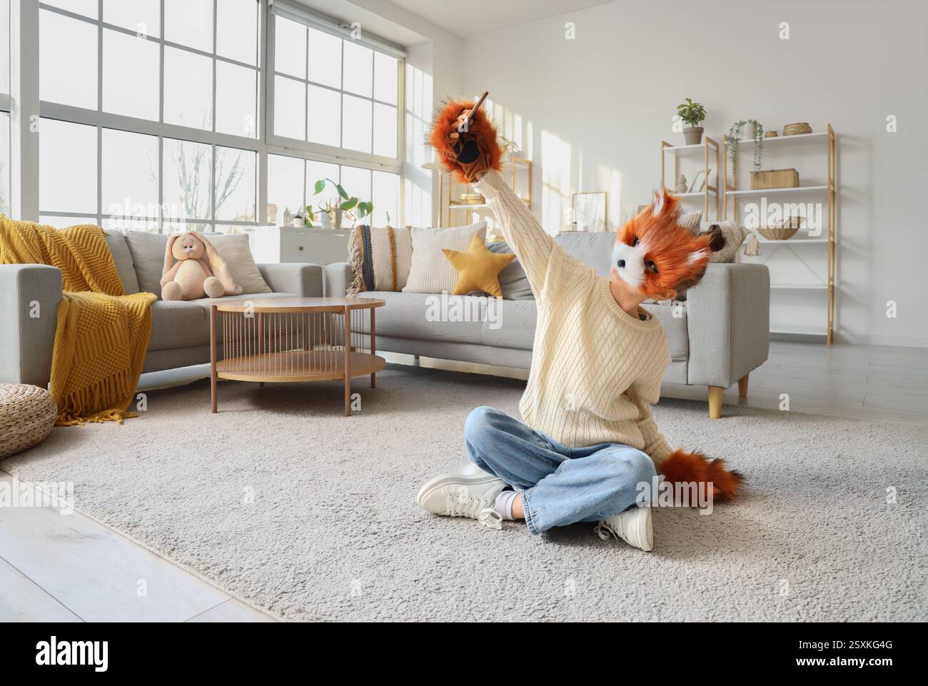 Quadrober girl in cat disguise taking selfie at home Stock Photo - Alamy