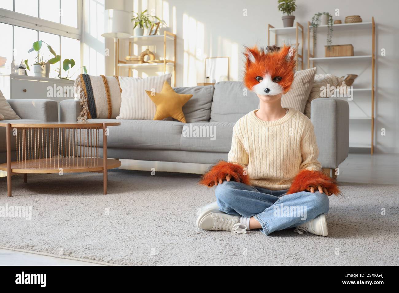 Quadrober girl in cat disguise at home Stock Photo - Alamy