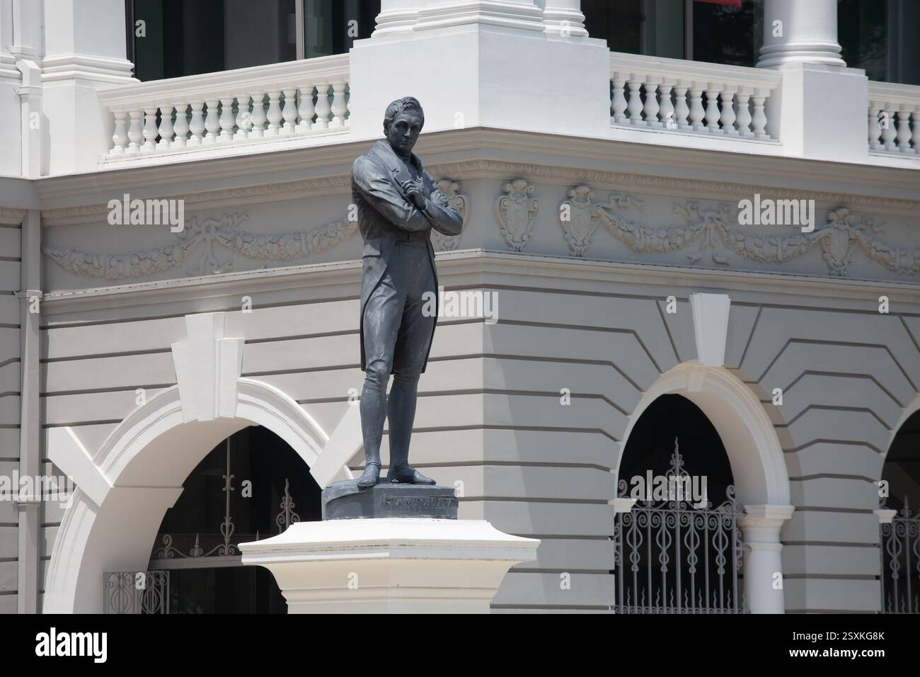 Sir Stamford Raffles standing black statue bronze sculpture, pose crossing his arms. Founder of ...