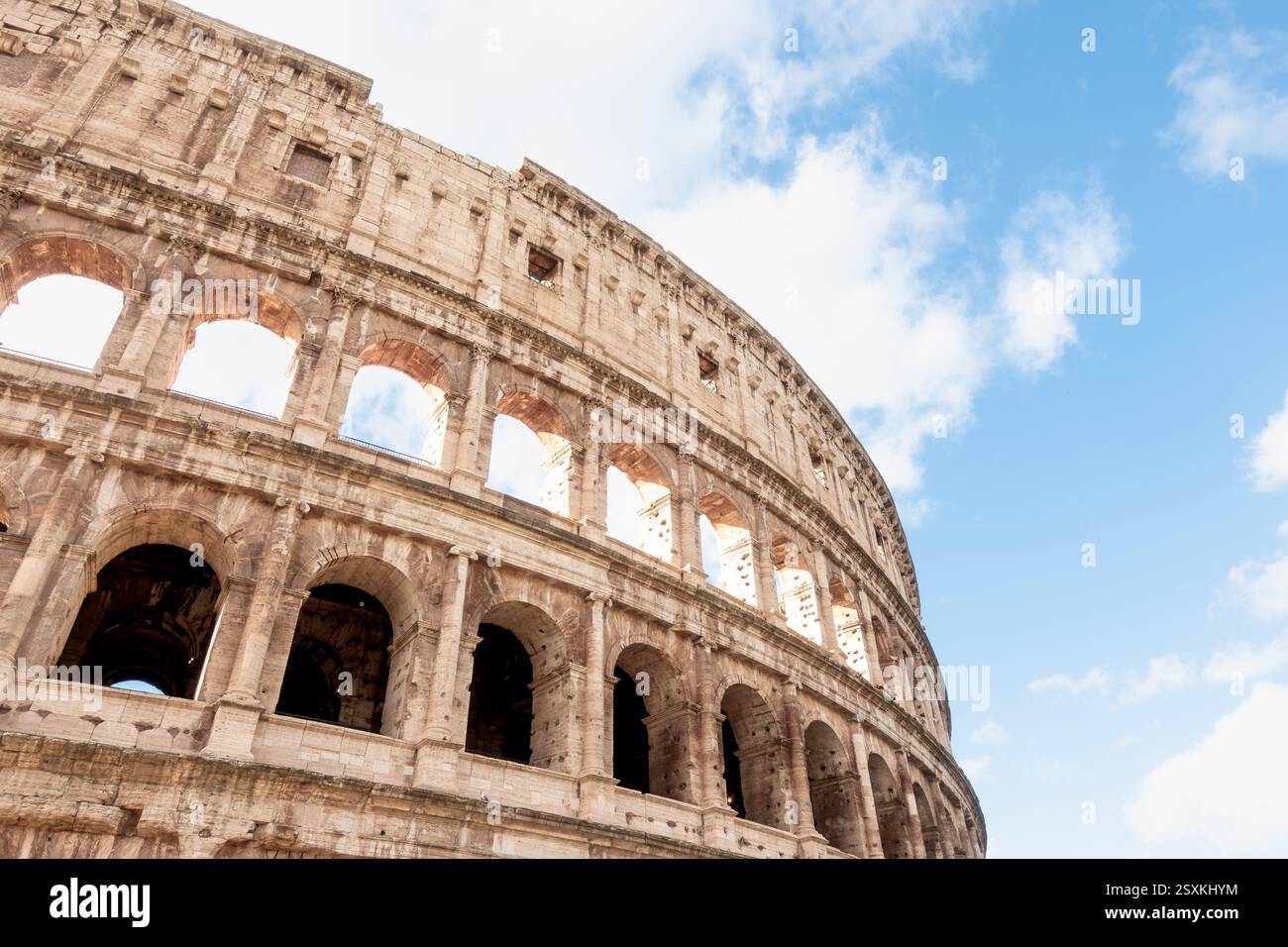 Facade and exterior of the ancient Roman Colosseum in Rome, Italy with ...