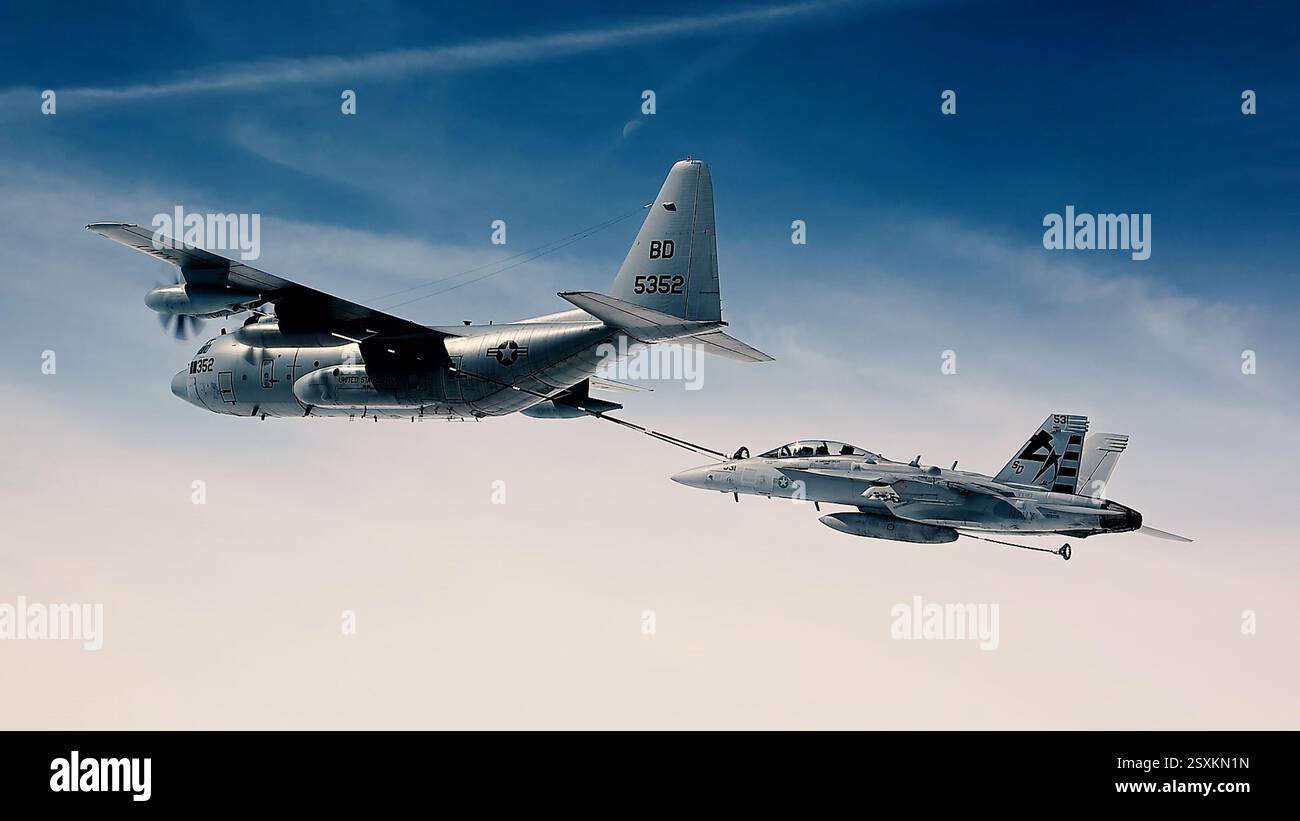 A U.S. Navy Reserve KC-130T refuels an EA-18G Growler in the skies over ...