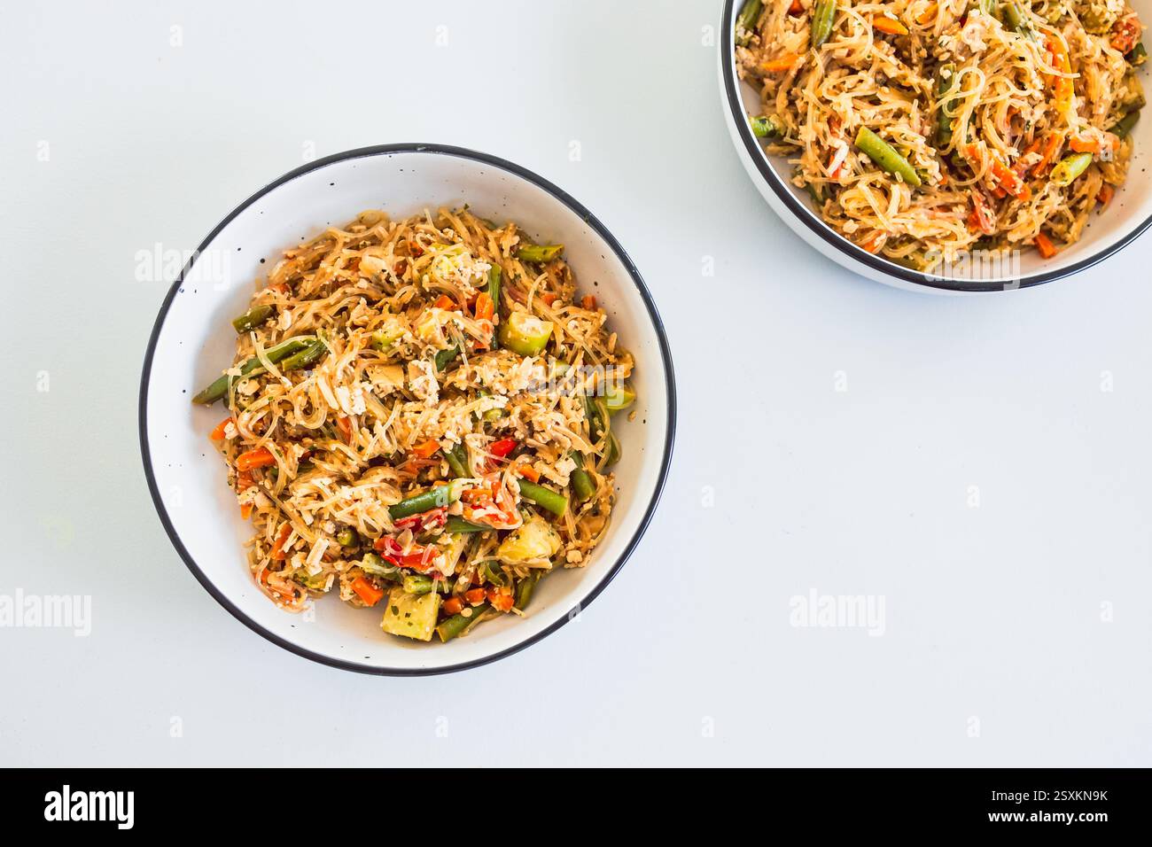 plant-based satay vermicelli noodle dish with veggies and tofu, healthy ...