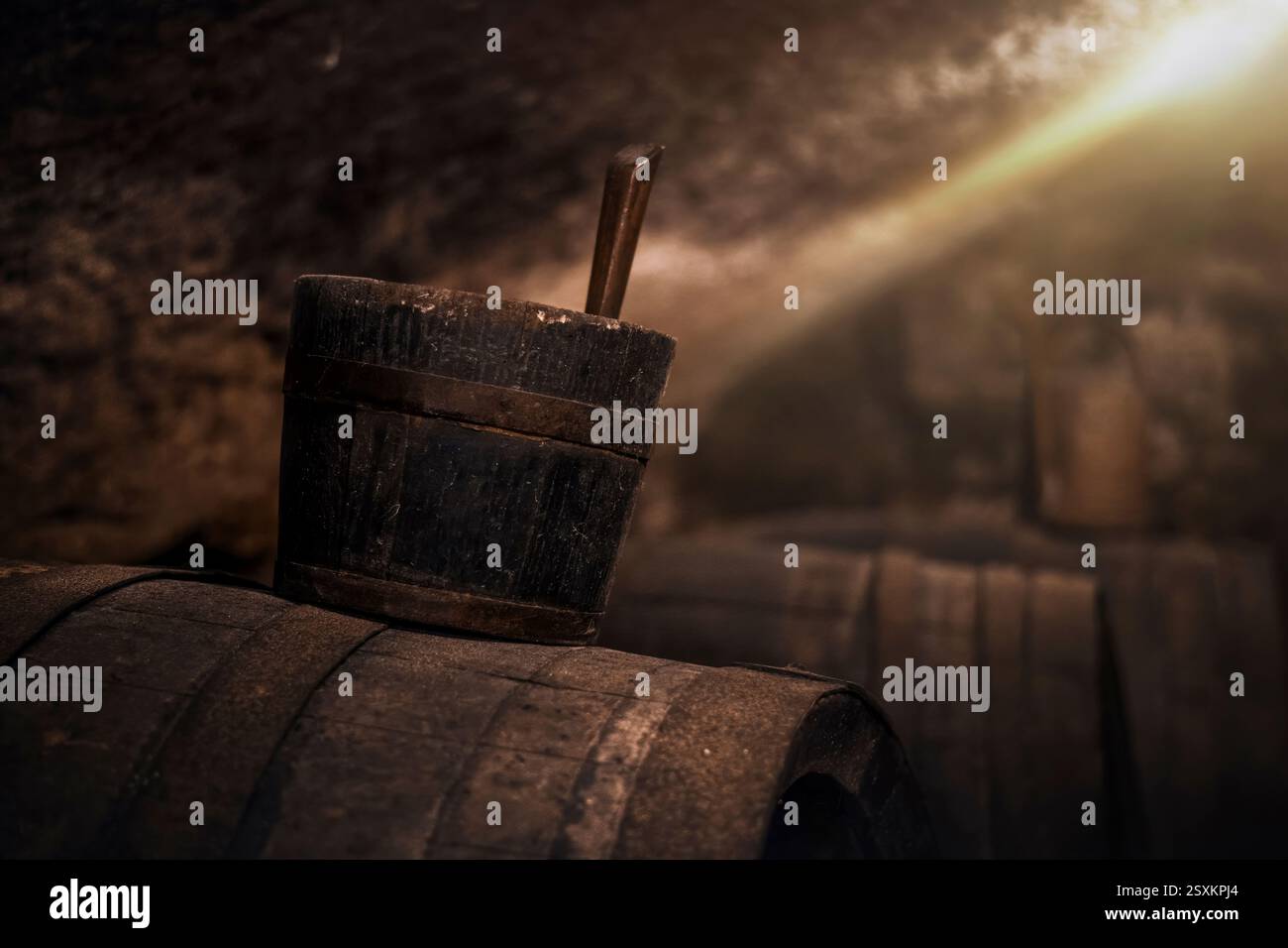 Old wooden bucket on a cask in the cellar Stock Photo - Alamy