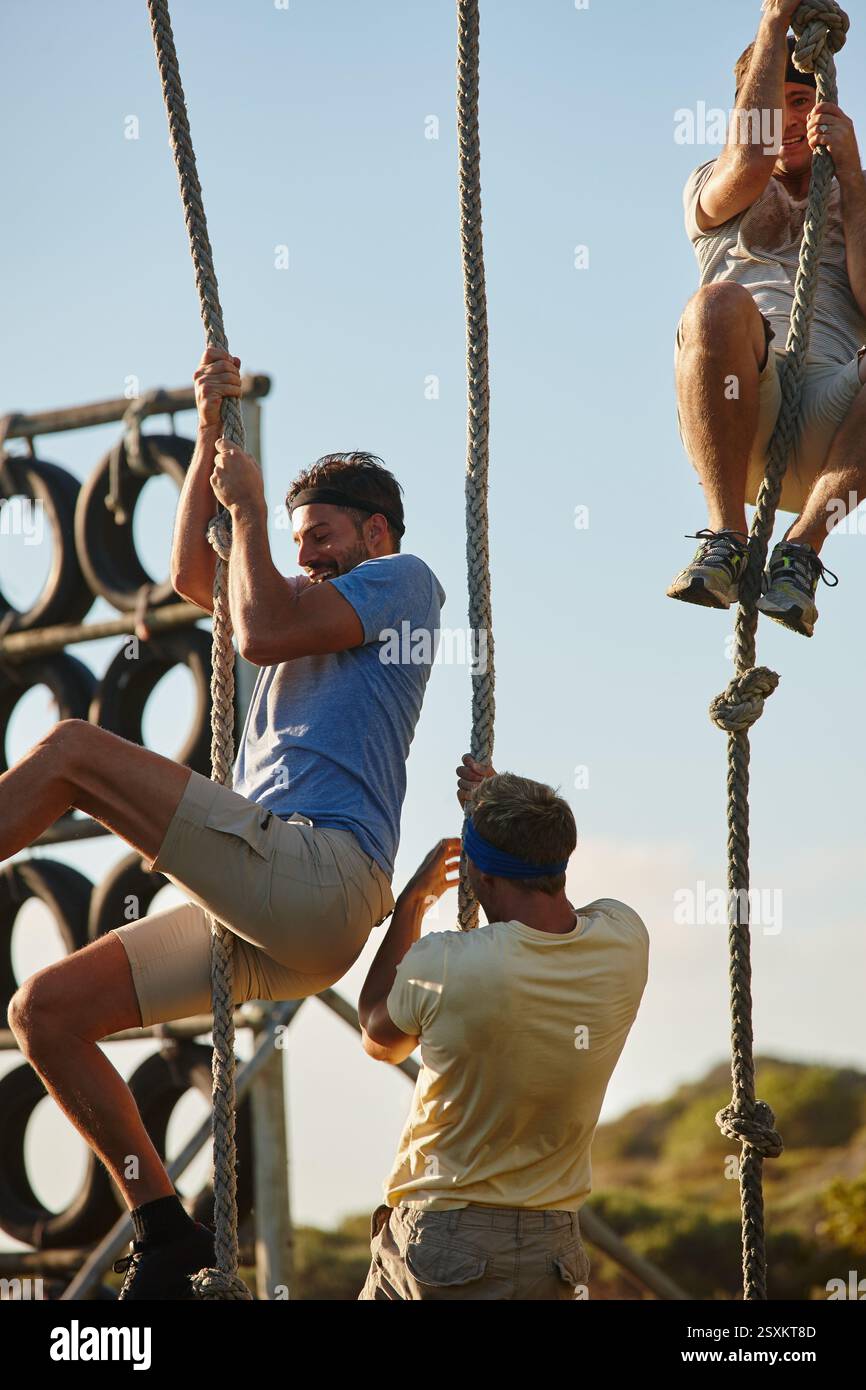 Men, rope or climbing in bootcamp for strength, exercise or army ...