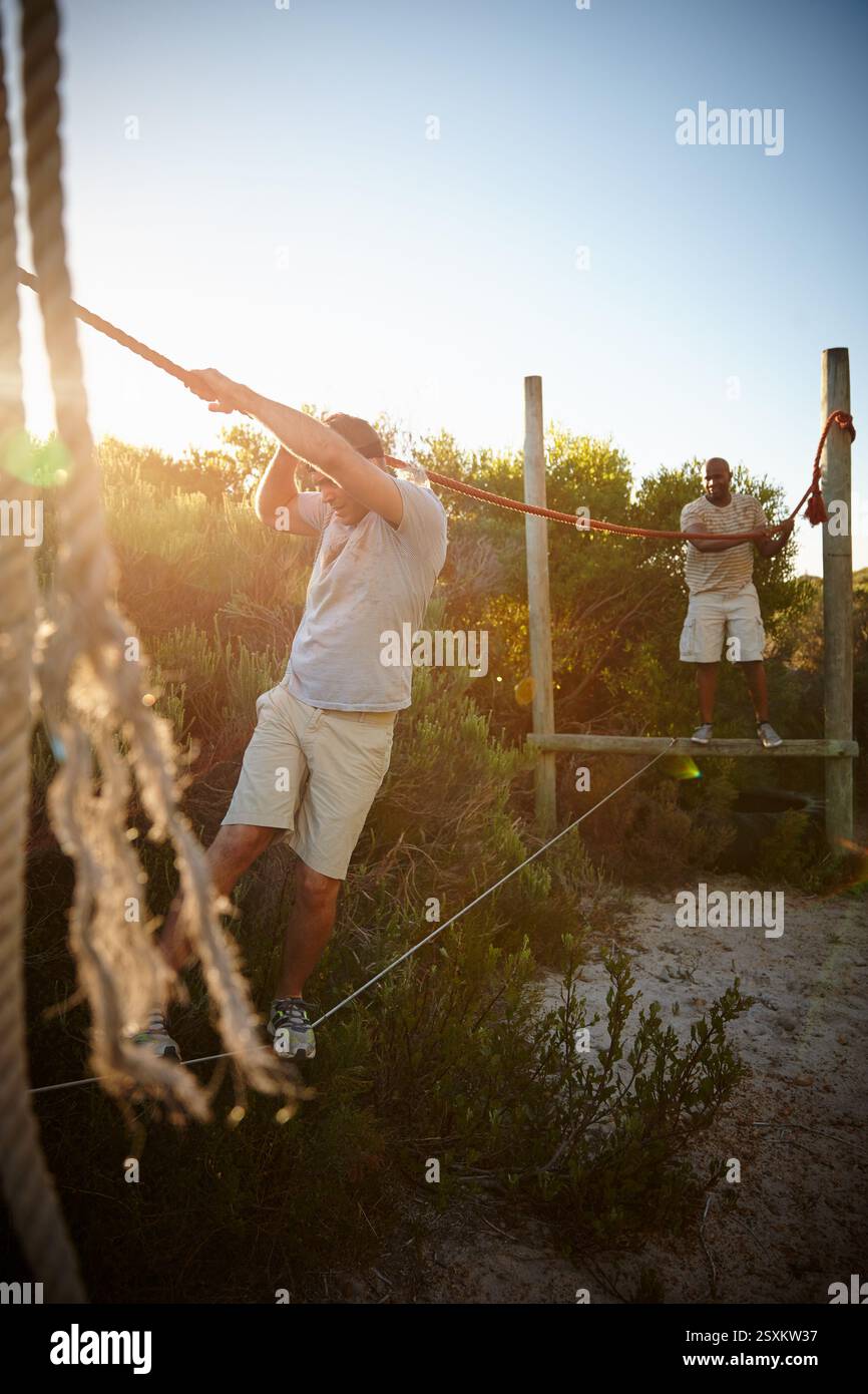 Active, men and rope for obstacle outdoor for physical strength, army ...