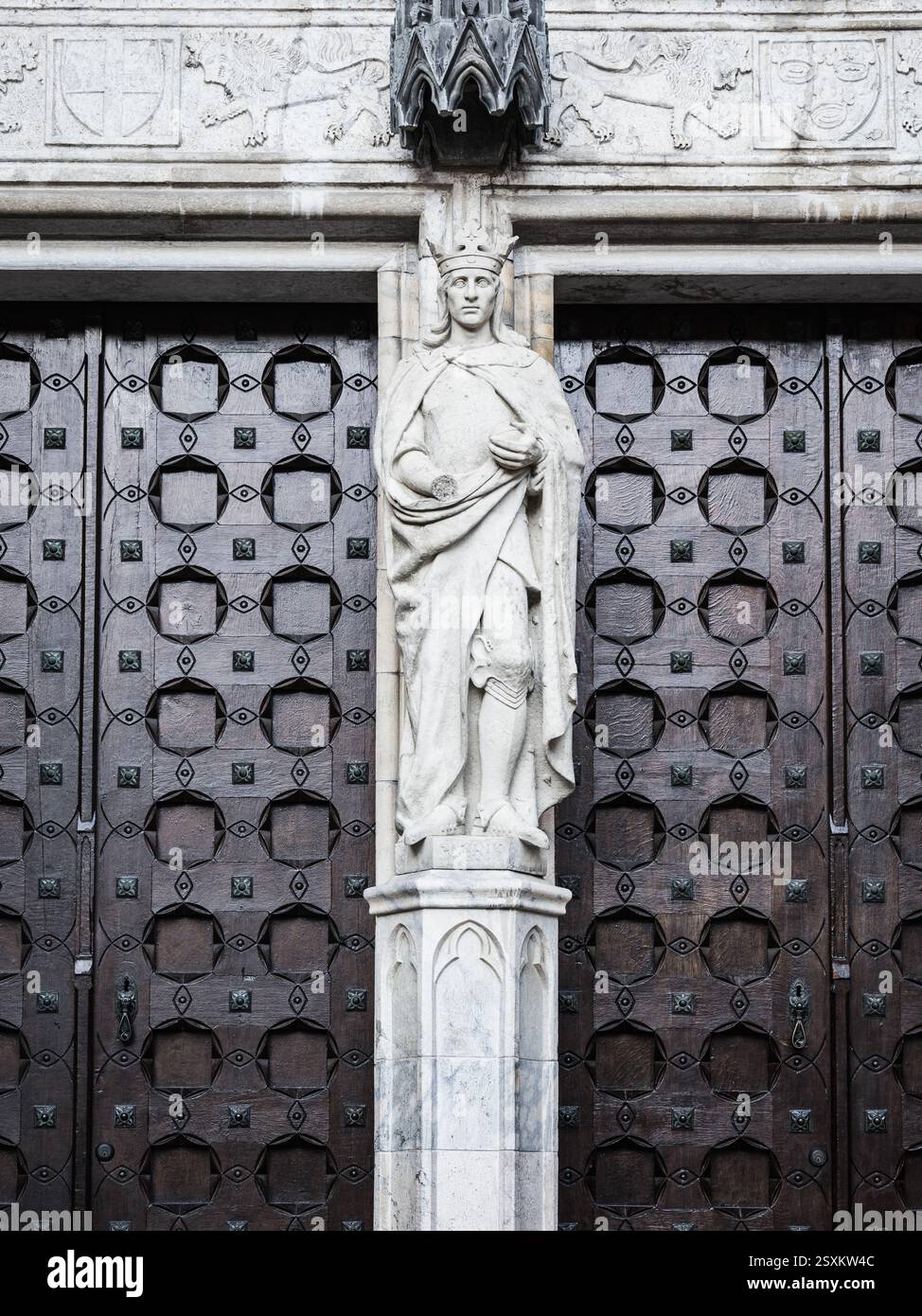 The entrance of Uppsala church features a magnificent stone statue ...