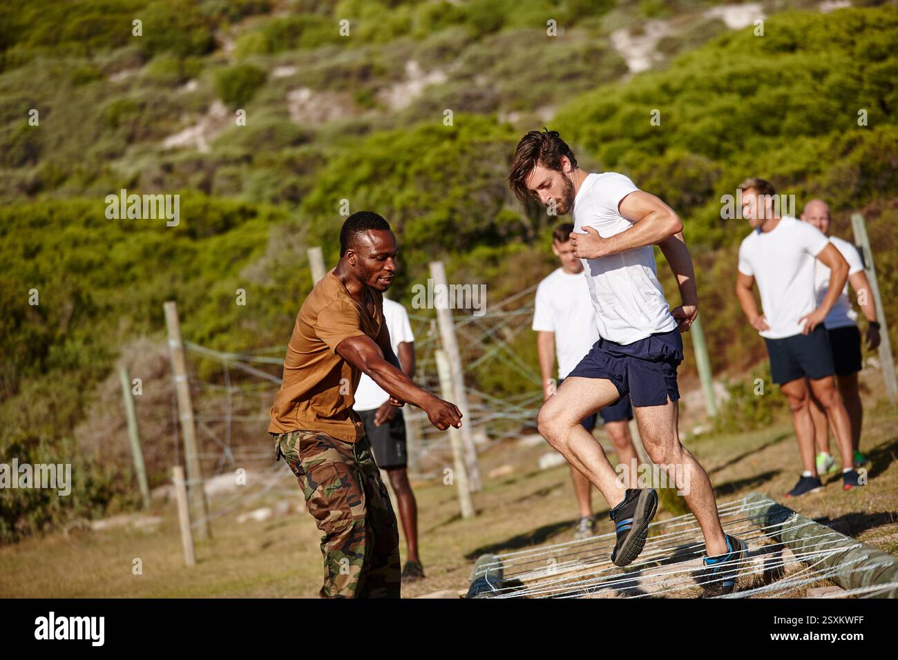 Bootcamp, exercise and obstacle course with men at military base for ...