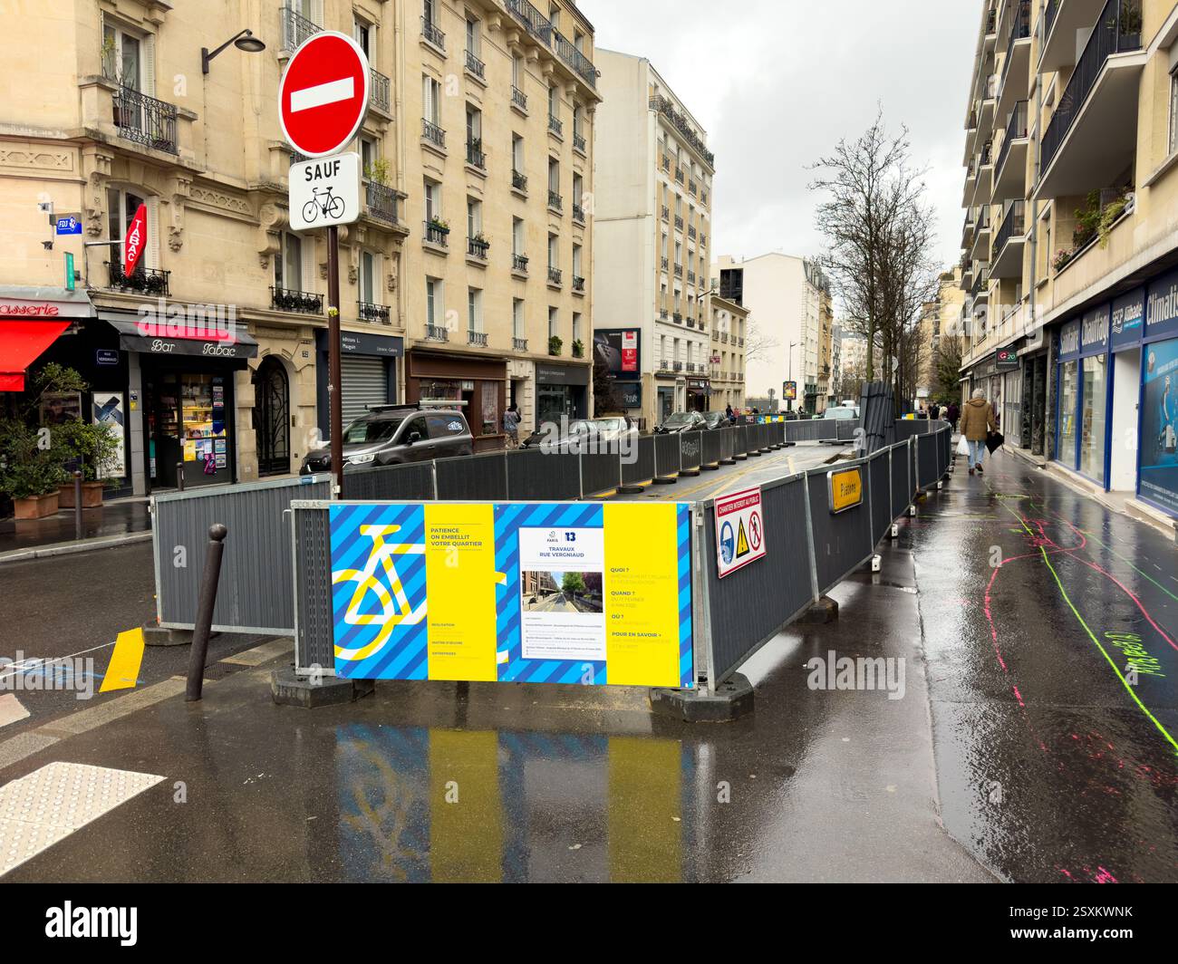 Urban street transformation with construction barriers for bike lane ...
