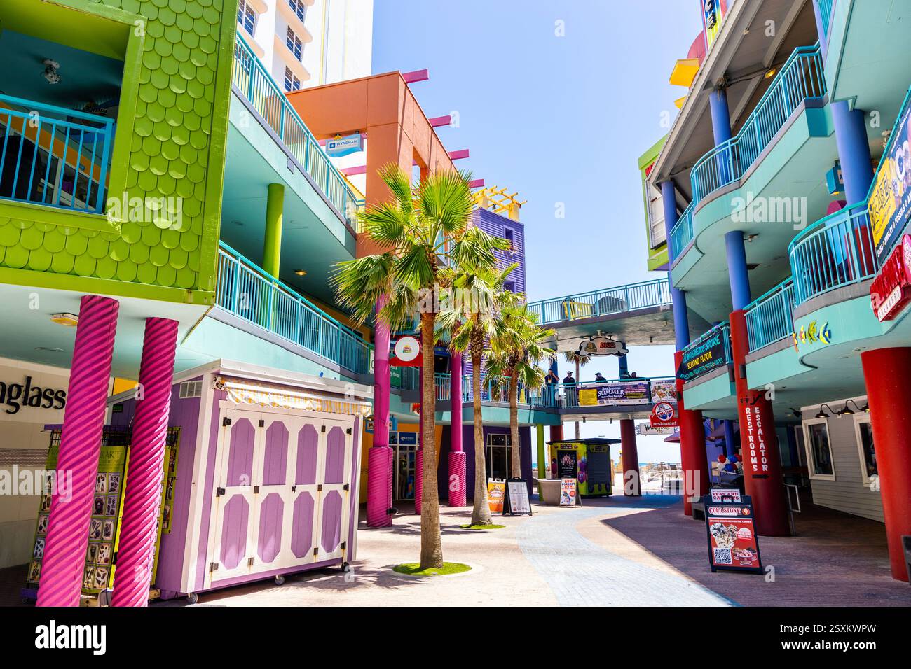 Colourful interior of Ocean Walk Shoppes shopping centrer at coastal ...