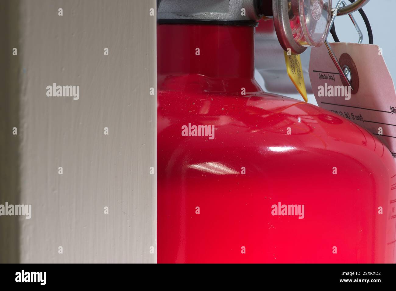 Close up view of top portion of fire extinguisher Stock Photo - Alamy