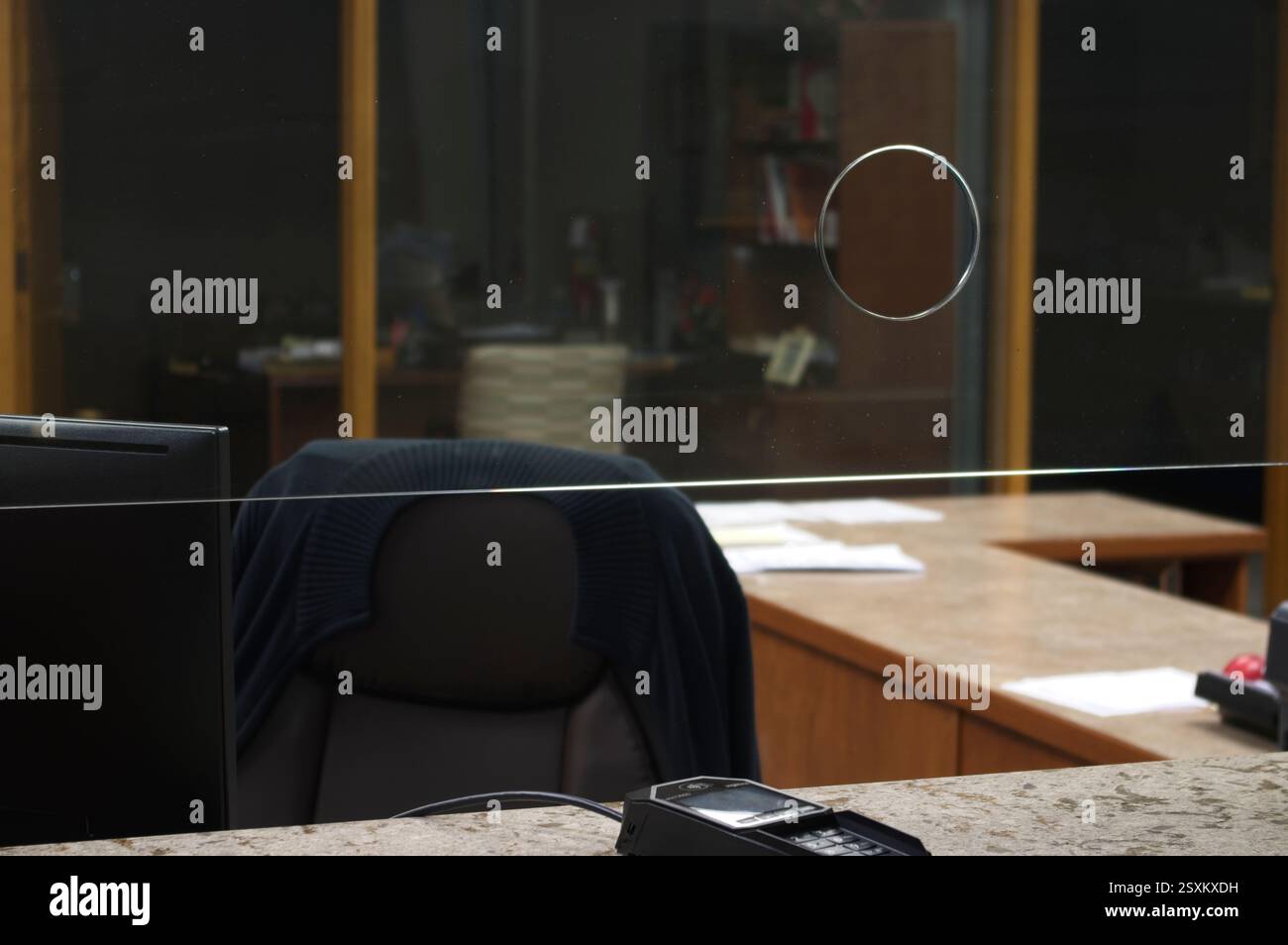 Teller area with glass divider Stock Photo - Alamy