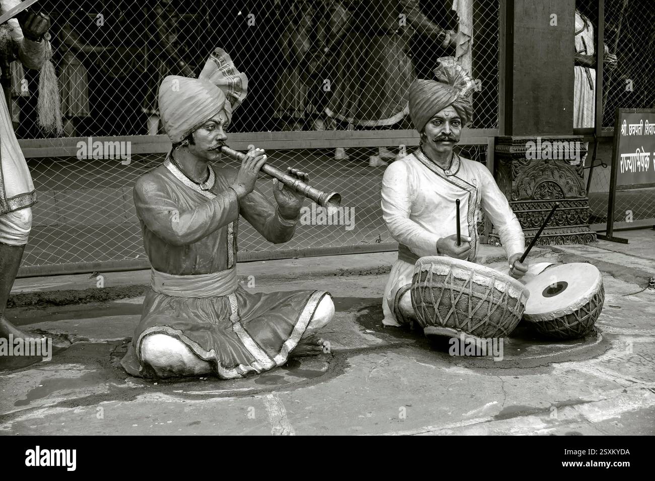 Black and white photo of statues of musicians playing musical ...