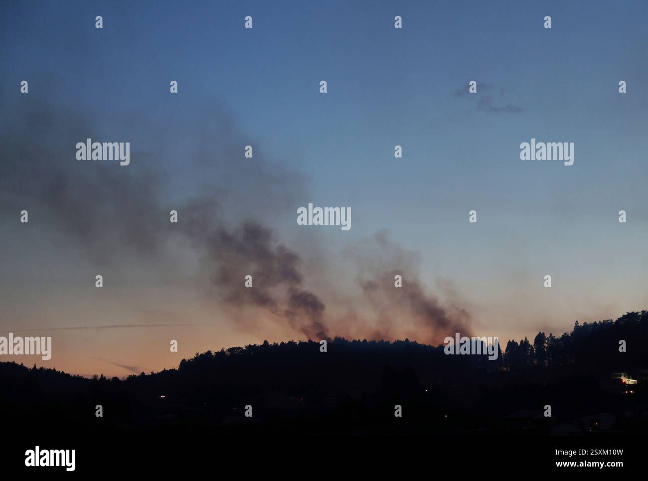 A photo shows a forest fire, continues to spread in Ofunato City, Iwate ...