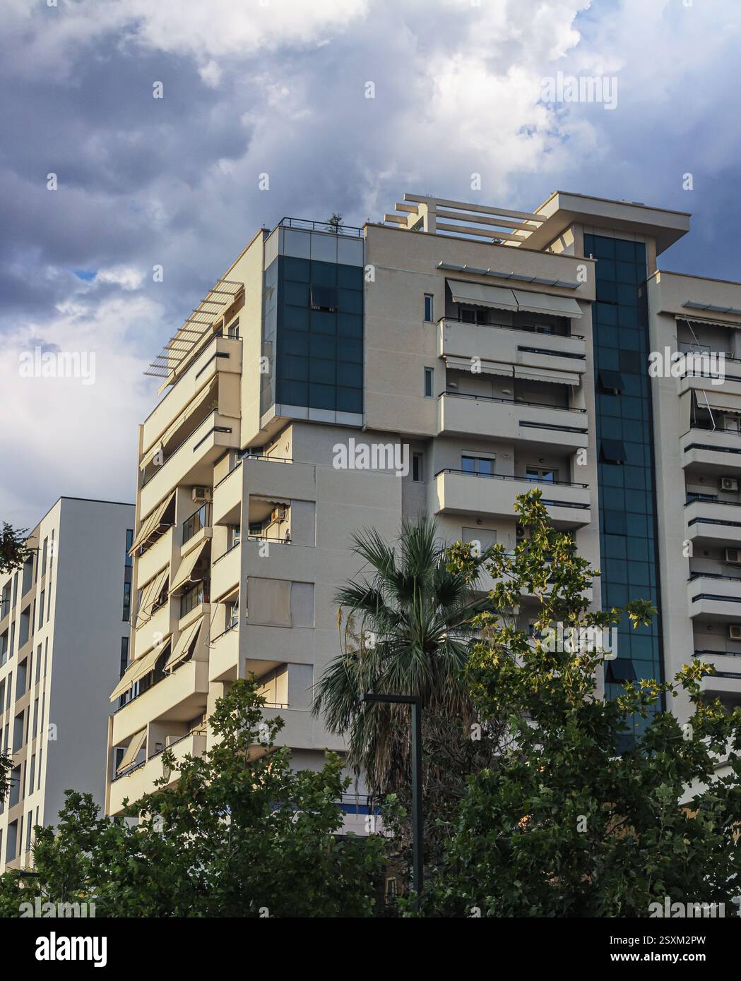 Tall residential buildings with modern architecture are surrounded by ...