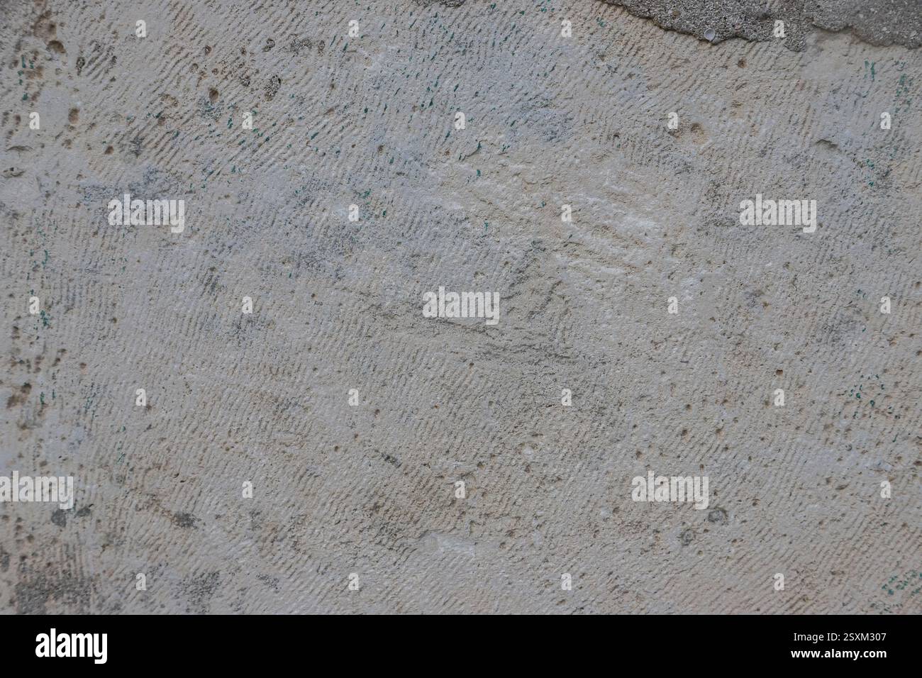 The surface displays a rough, unfinished concrete texture with ...