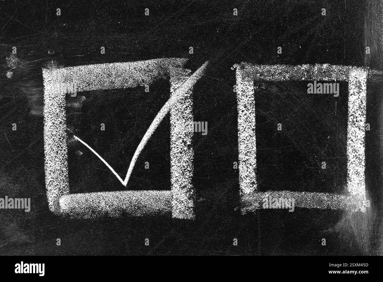 White chalk drawing of voting check mark and boxes on black grunge ...