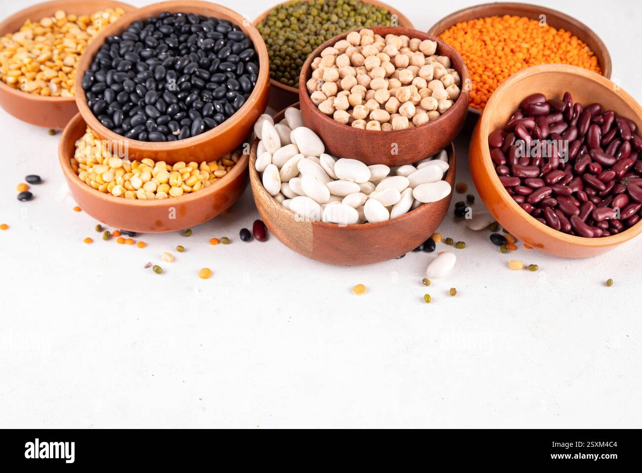 Various dried beans, lentils, mung, chickpea, pea assortment in wooden ...