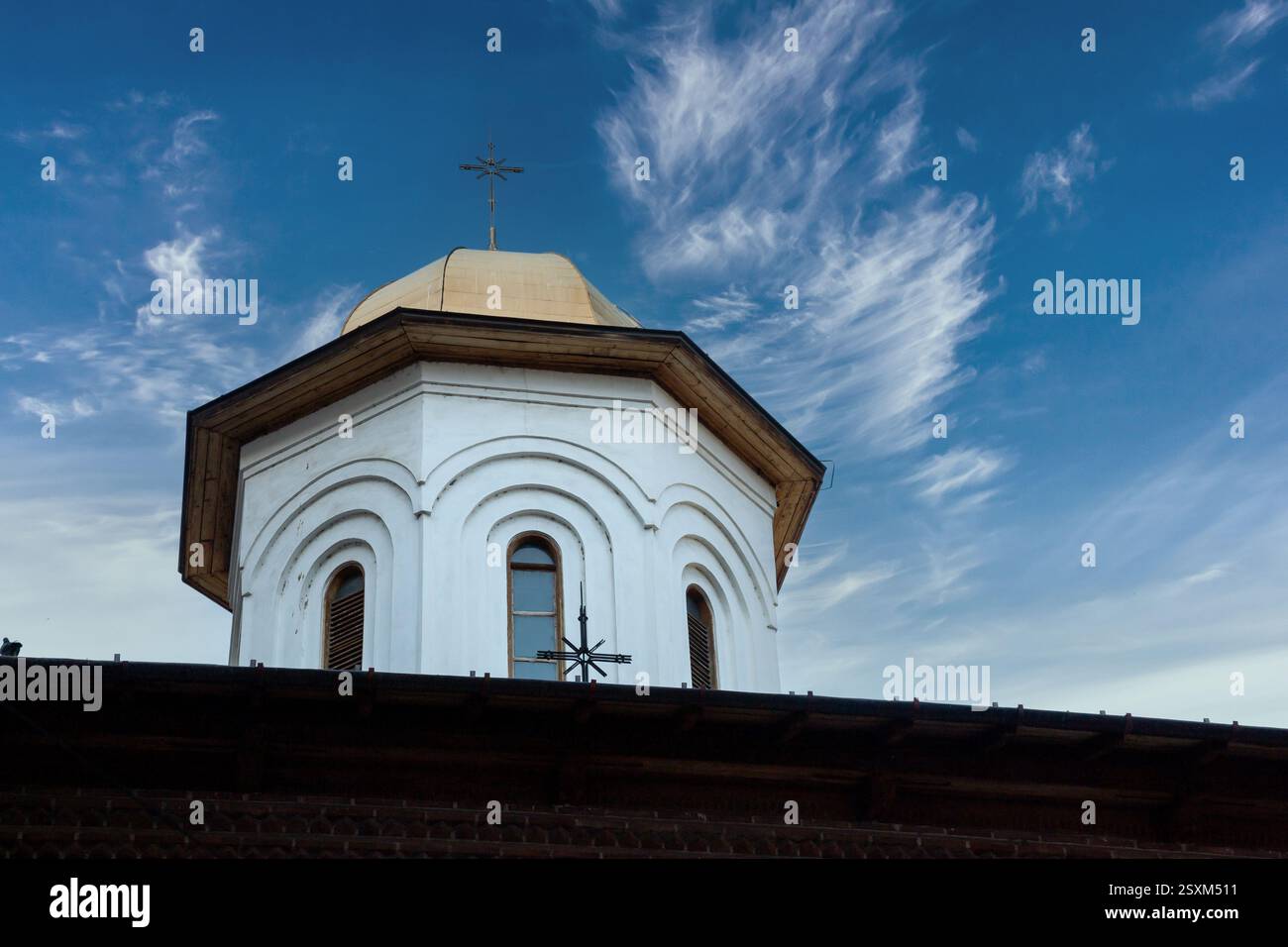 The striking architecture of a historic church bell tower features a ...