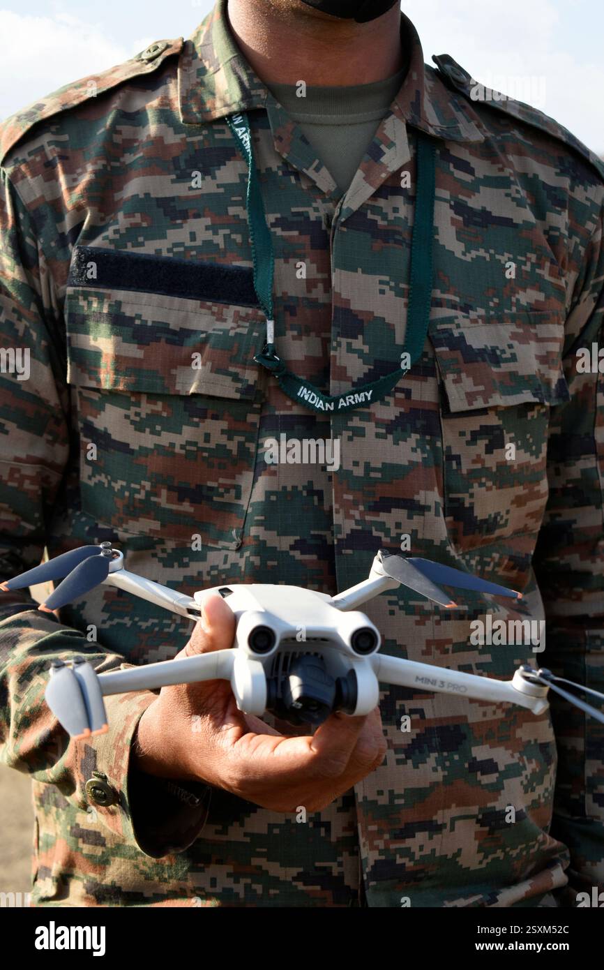 A modern technology drone (DJI MAVIC MII 3 Pro) held by a soldier on ...