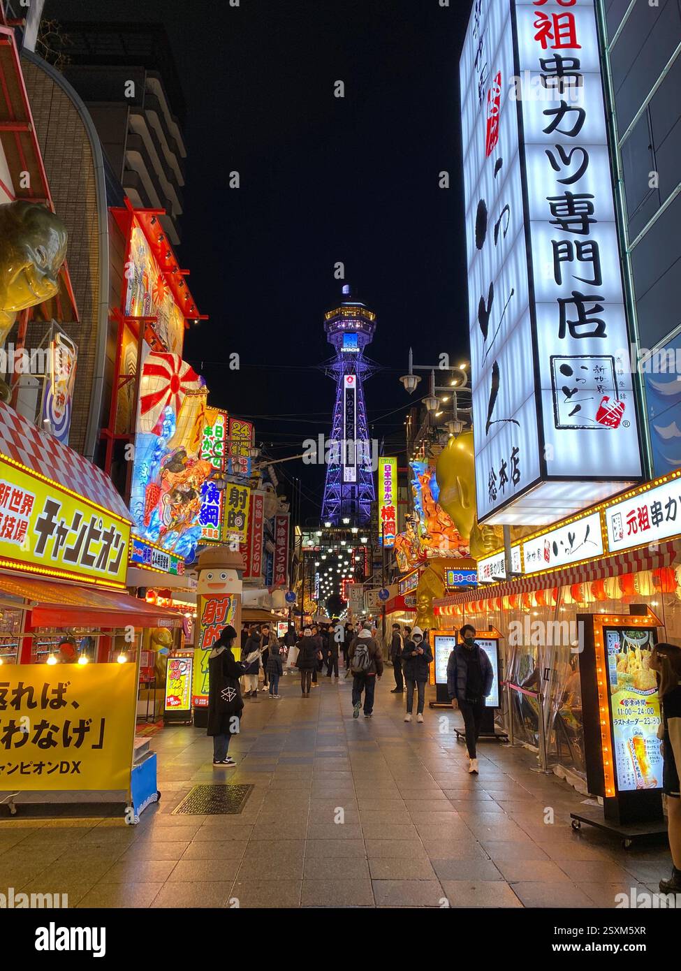 In the neighborhood of Osaka Tsutenkaku tower and its colourful and ...
