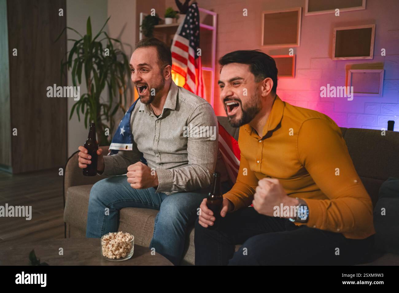 Excitement fills the room as friends cheer for their favorite team ...