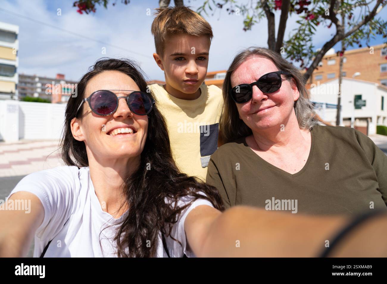 Smiling family capturing a joyful moment together Stock Photo - Alamy
