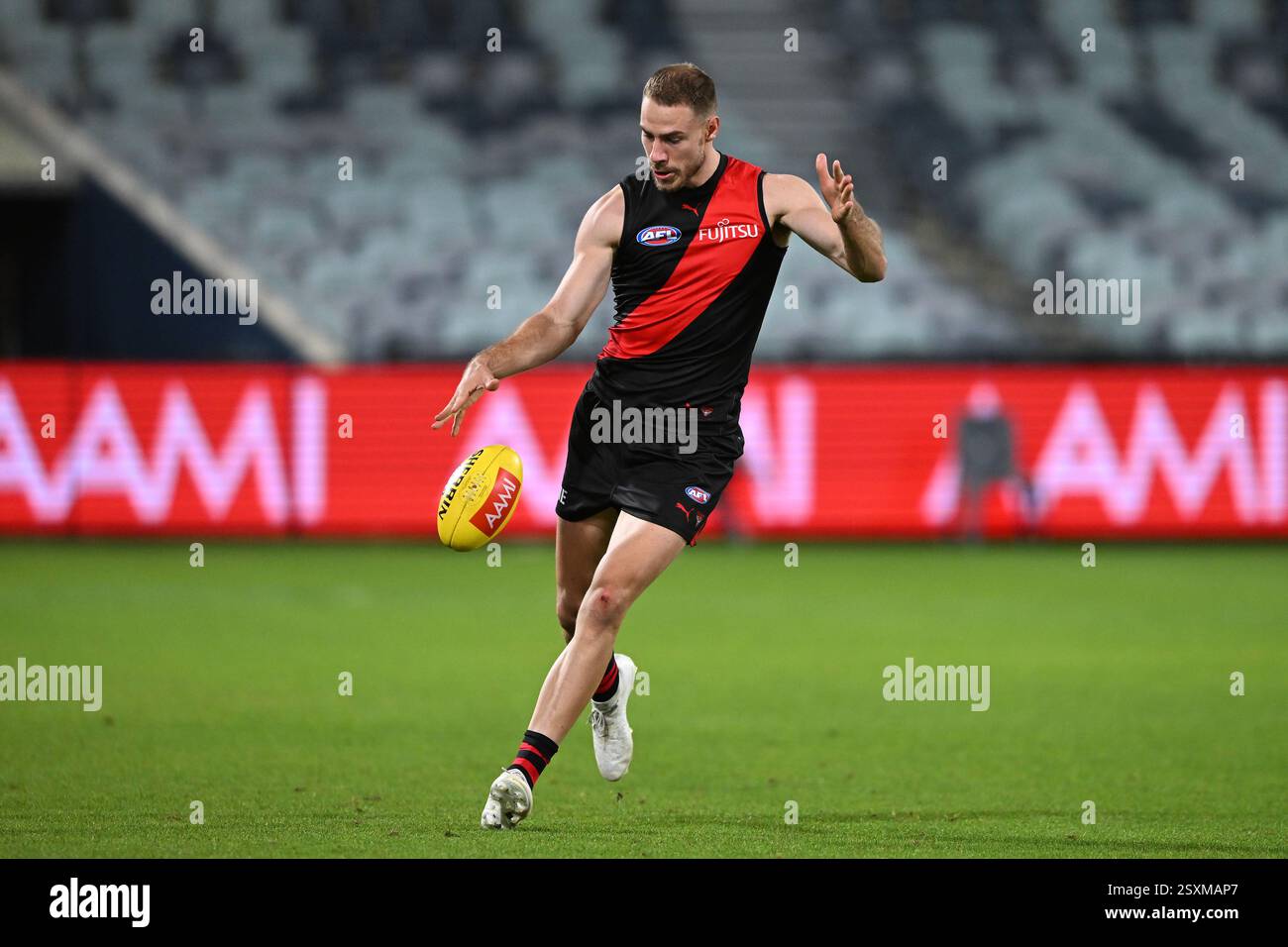 Geelong, Australia. 25th Feb, 2025. Ben Mckay of Essendon kicks the ...