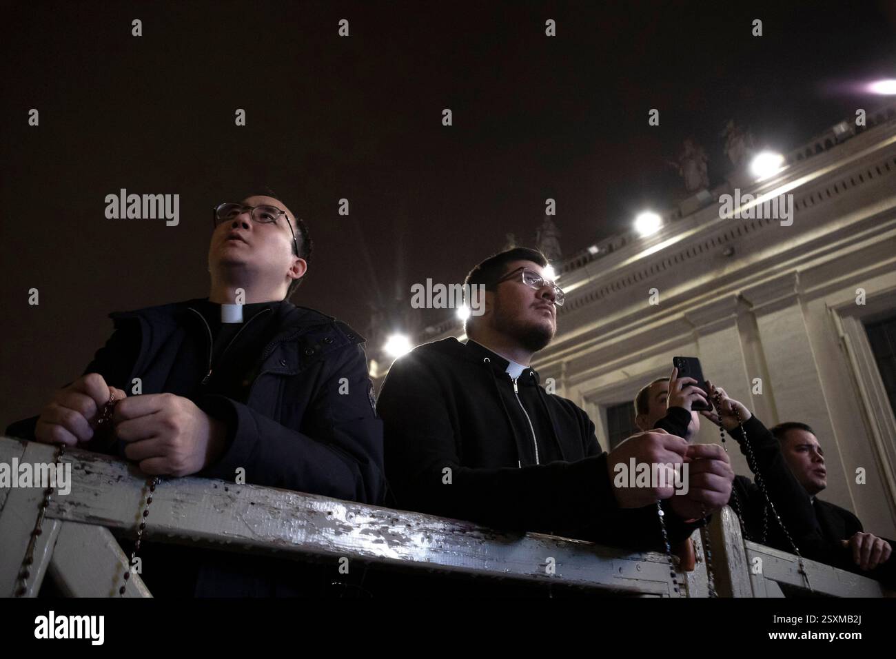 Vatican City, Vatican, 24 February 2025. Faithful pray during a rosary ...