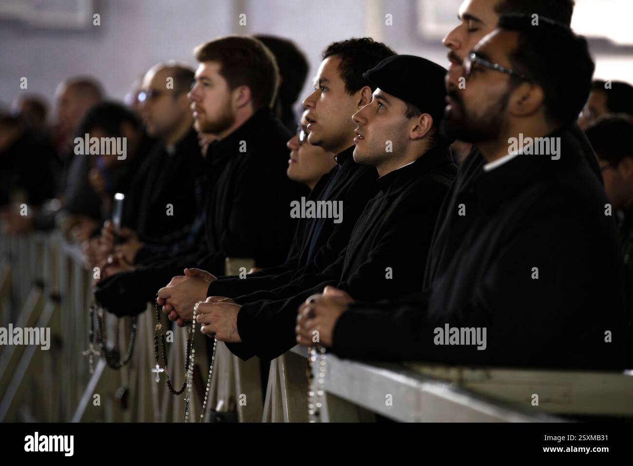 Vatican City, Vatican, 24 February 2025. Faithful pray during a rosary ...
