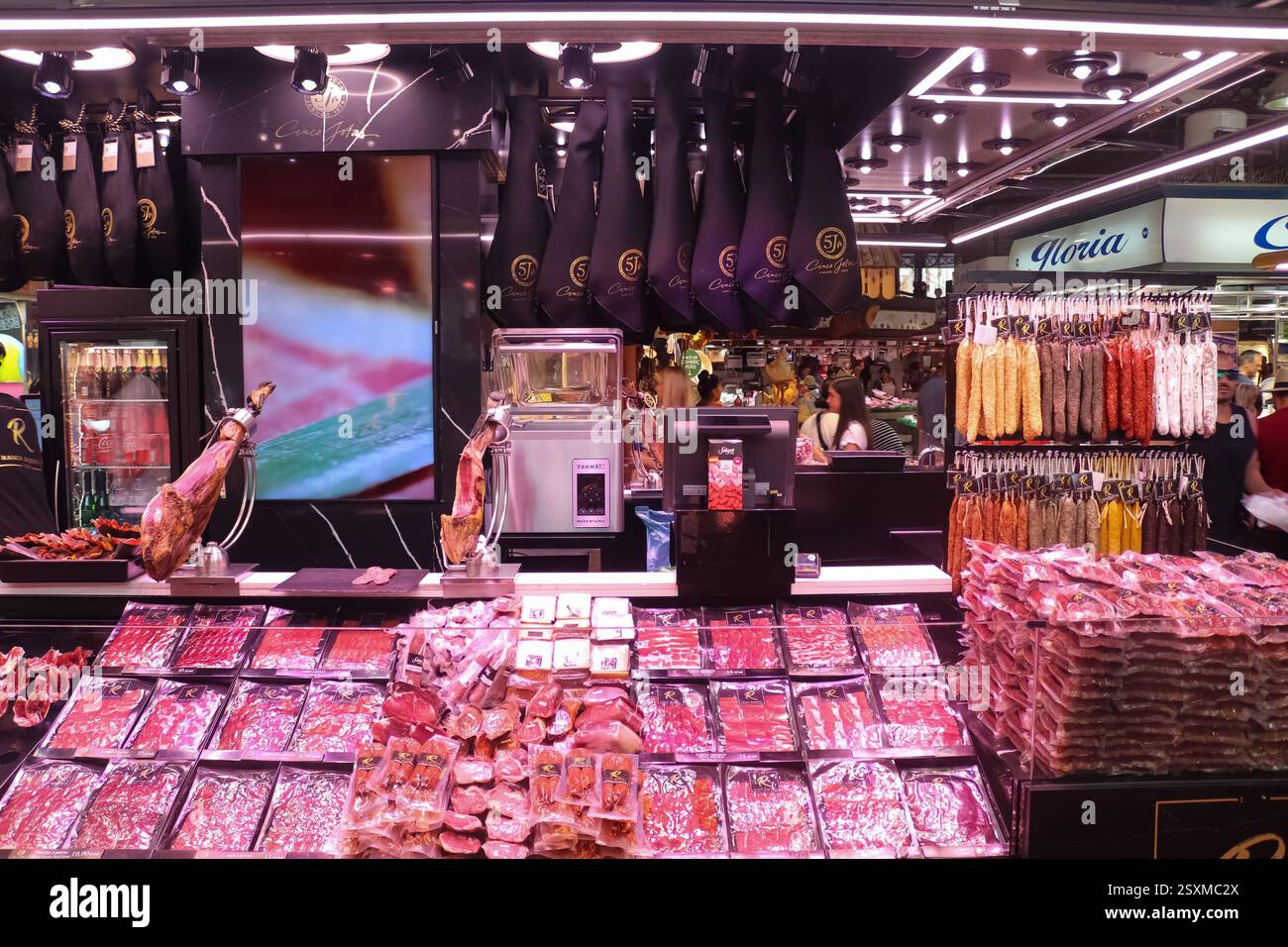 Barcelona, 18. July 2024: Spanish cured ham and chorizo sausages ...