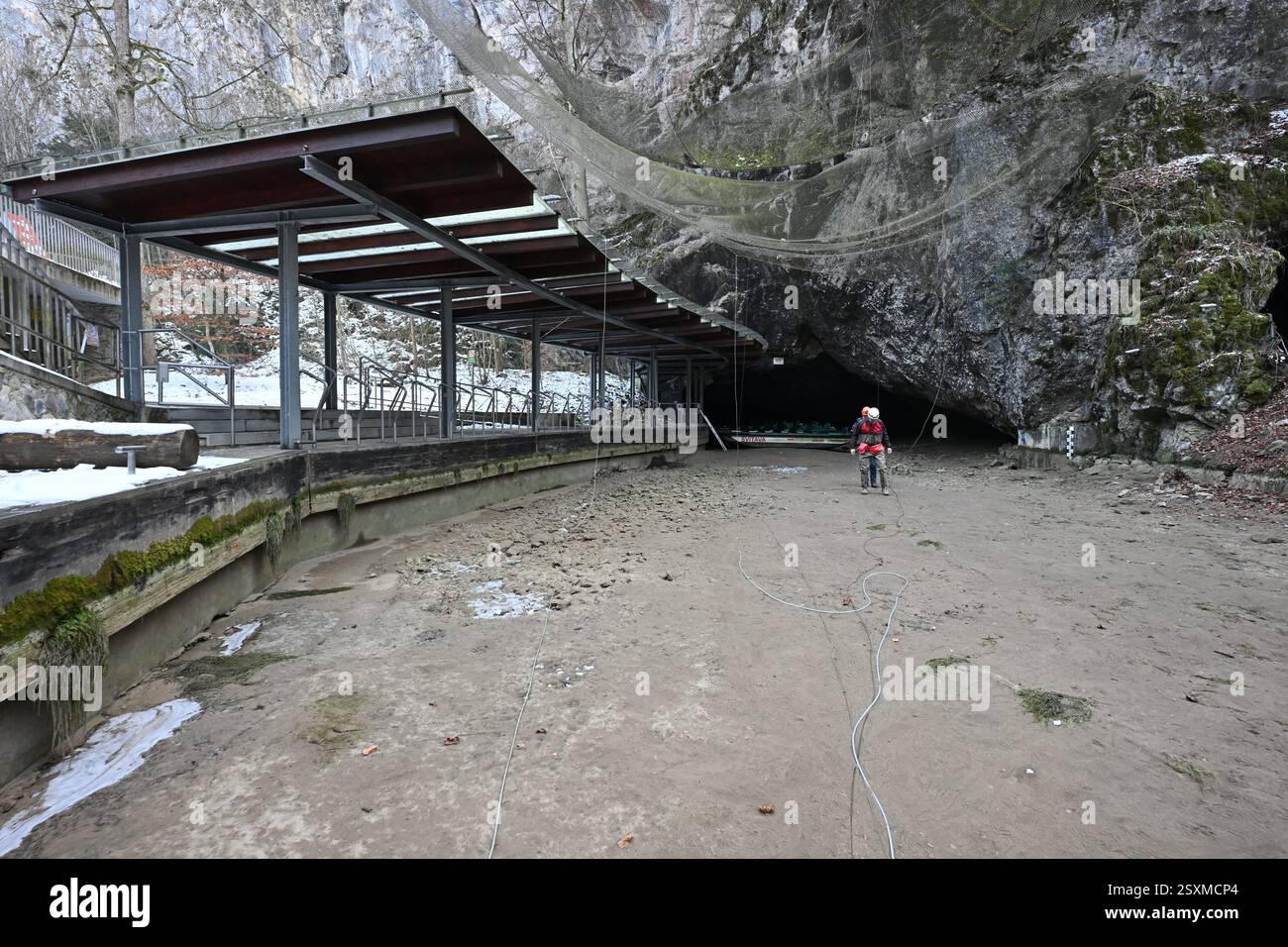 Workers repair electrical installation in tourist route along the ...