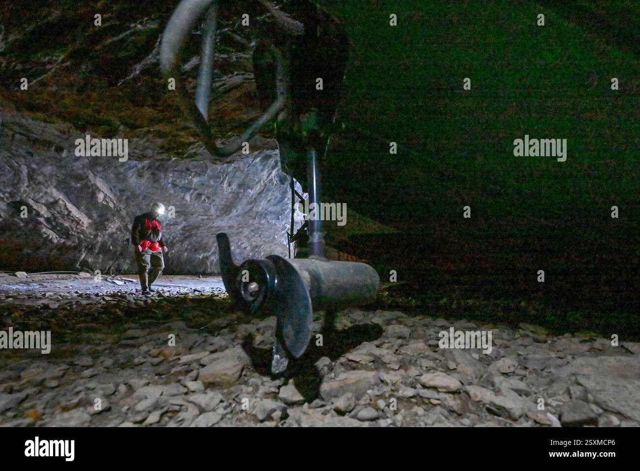 Workers repair electrical installation in tourist route along the ...