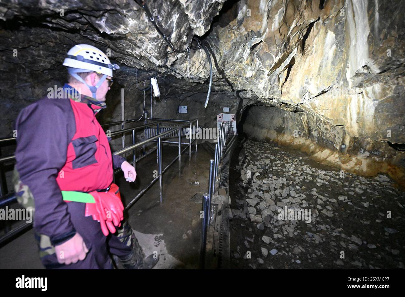 Workers repair electrical installation in tourist route along the ...