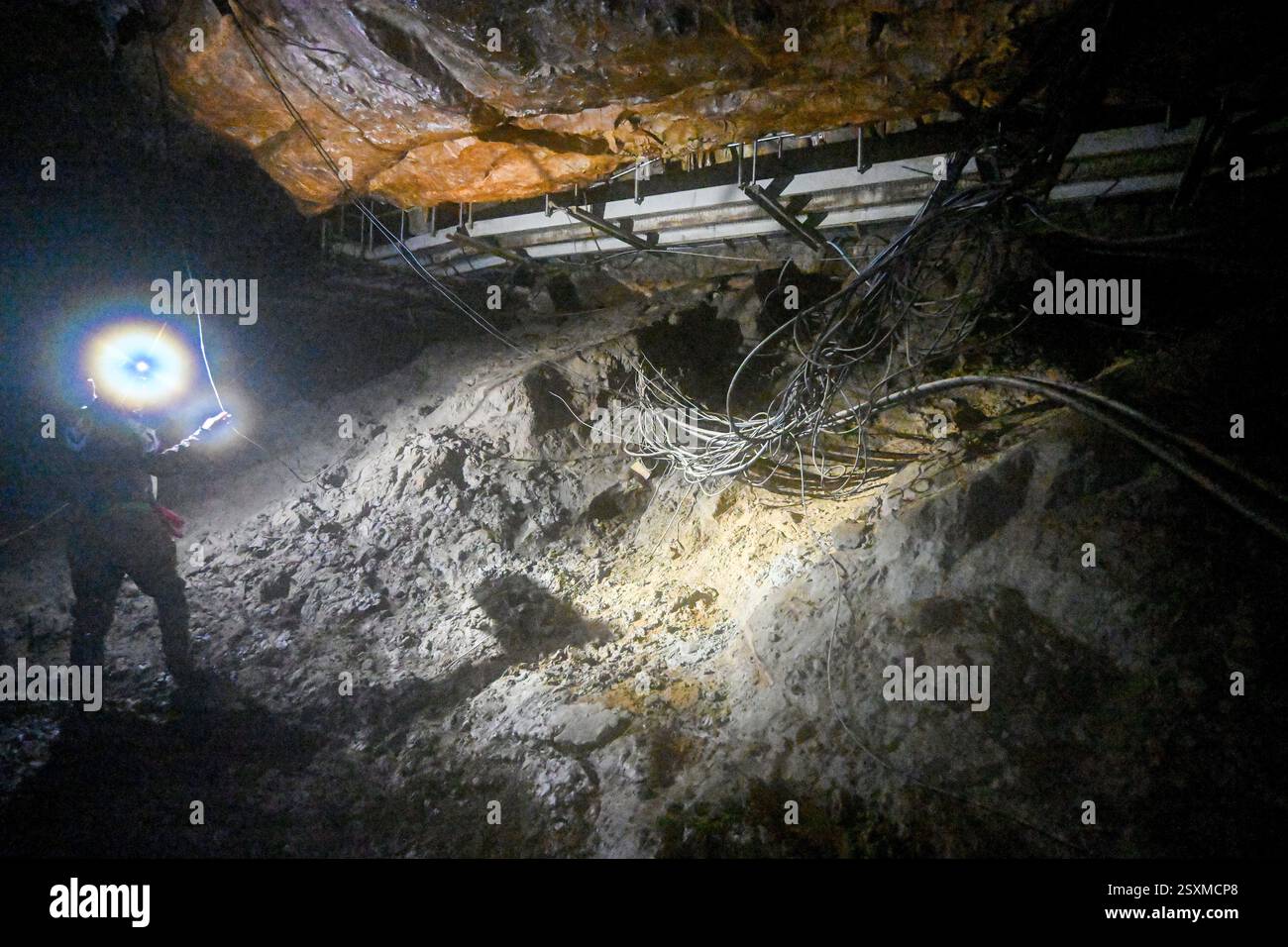 Workers repair electrical installation in tourist route along the ...