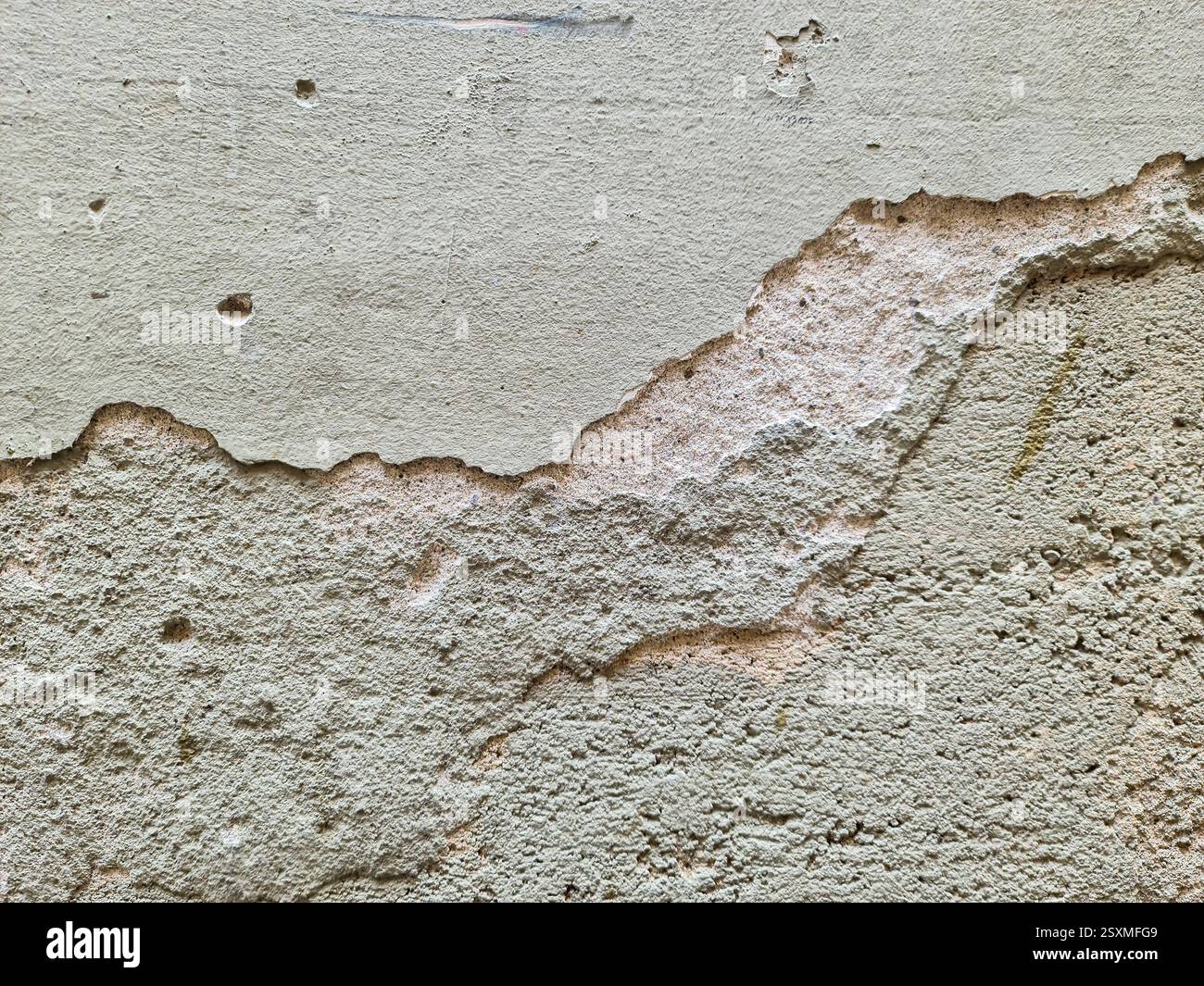 Close up of decaying plaster revealing the underlying surface, creating ...