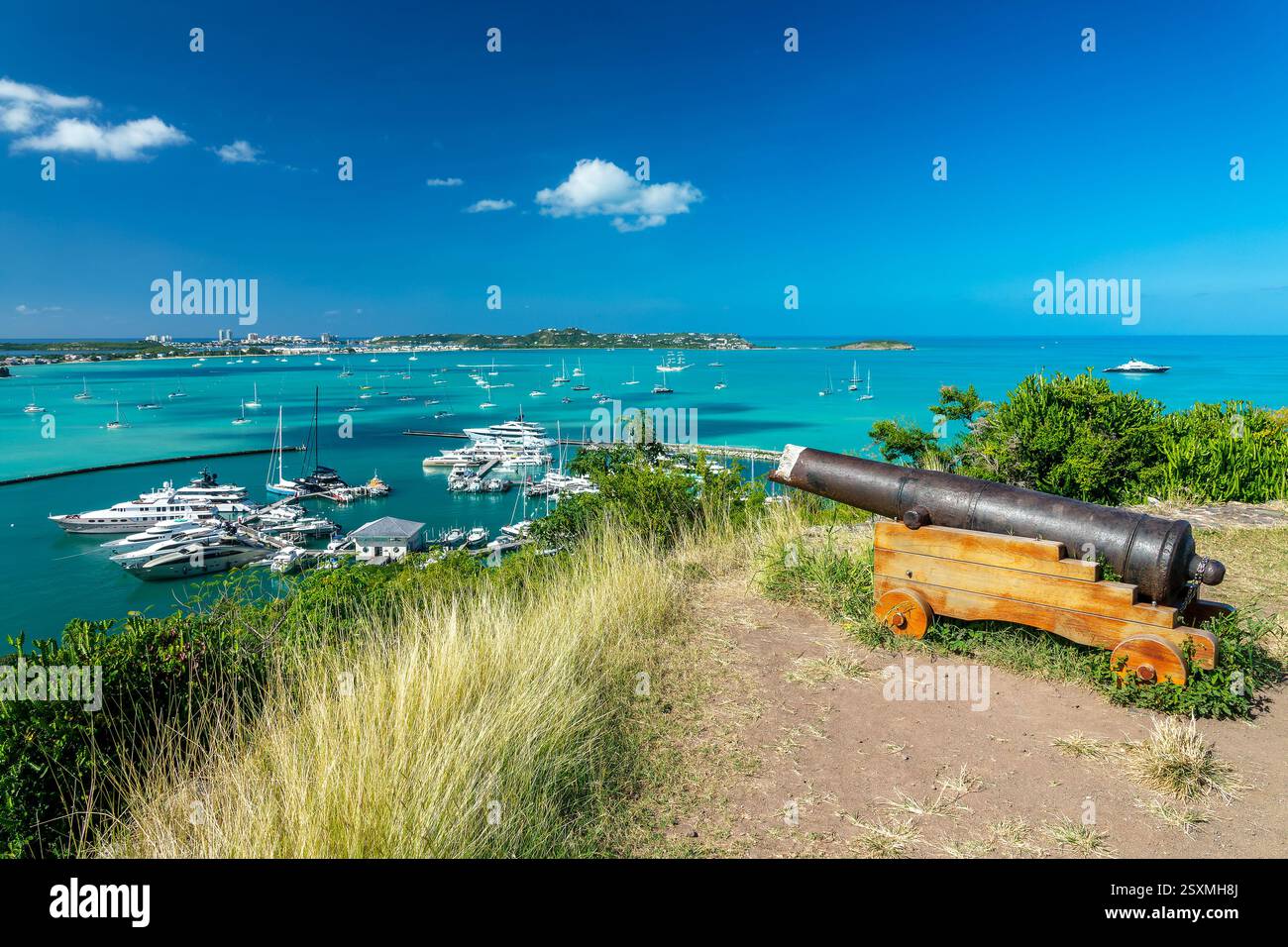 Canon at Fort Louis and the bay of Marigot in the Caribbean island of ...