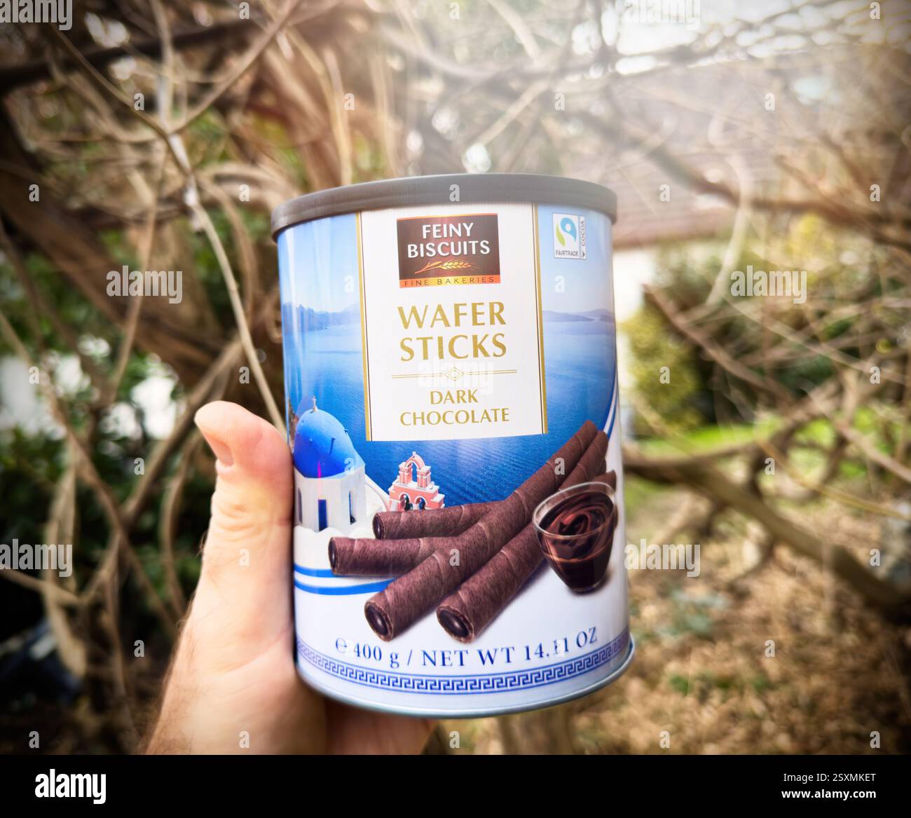 Paris, France - Feb 17, 2025: A hand holds a tin of Feiny Biscuits ...