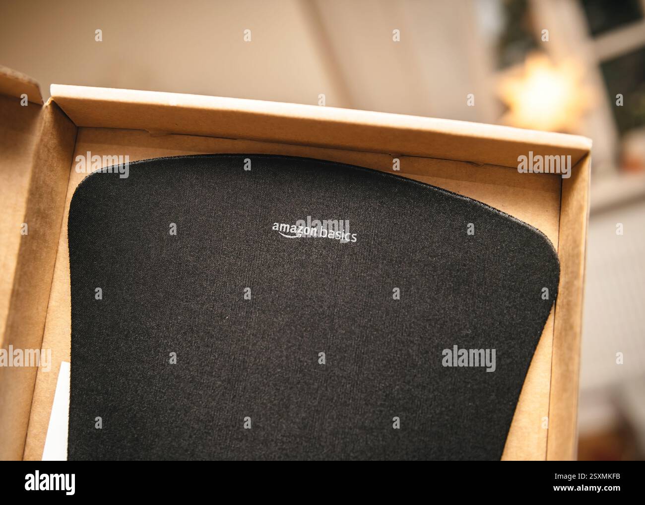Paris, France - Feb 17, 2025: A black Amazon Basics mouse pad with a ...