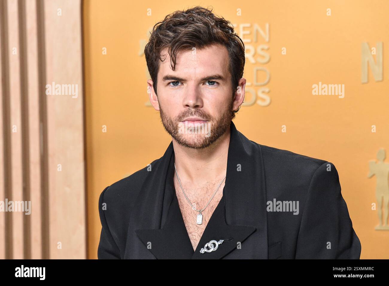LOS ANGELES, CALIFORNIA, USA - FEBRUARY 23: Luke Newton wearing a TAG ...