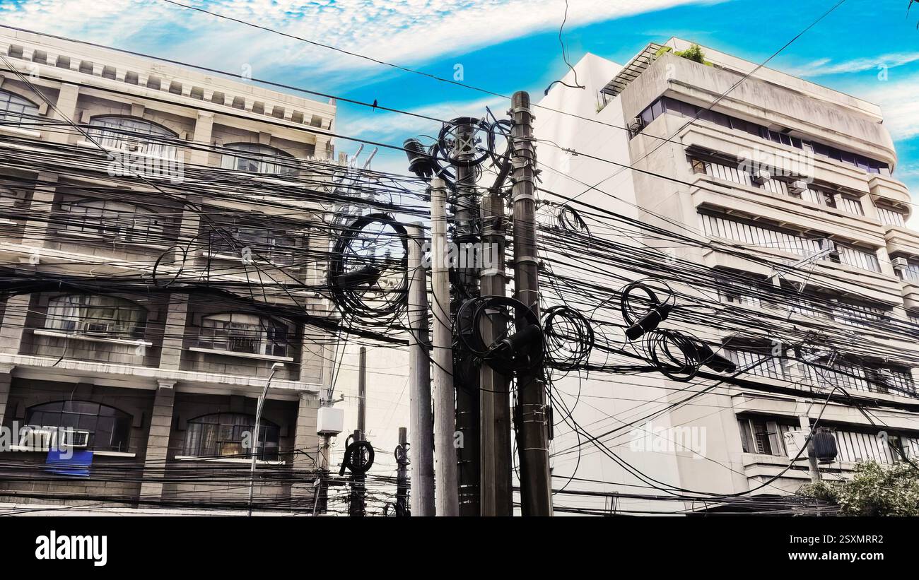 Utility pole displays multiple cable connections and junction boxes ...