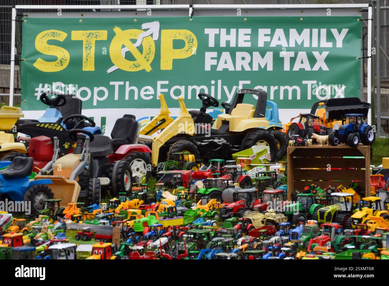 February 25, 2025, London, England, UK: Farmers display toy tractors ...