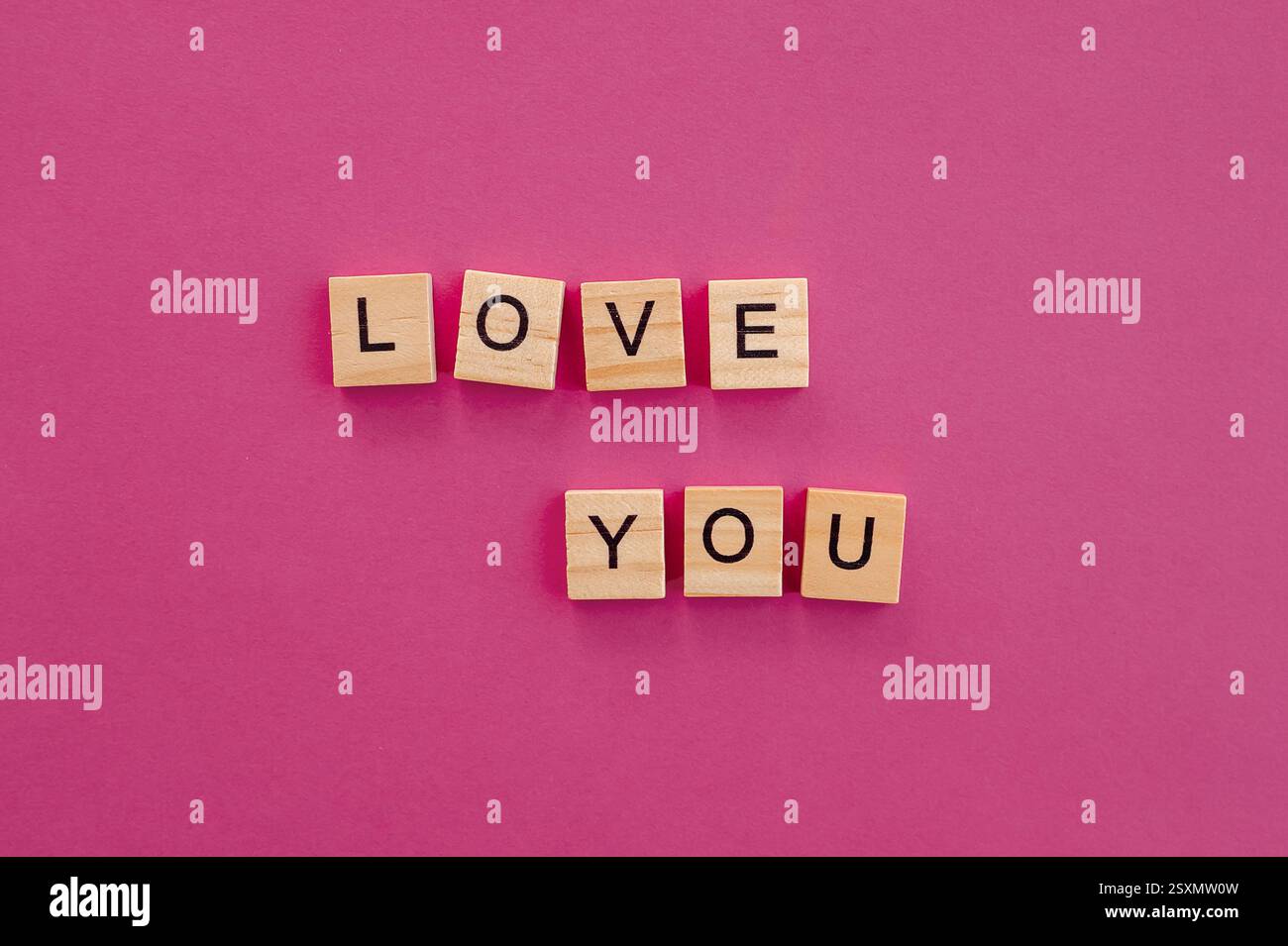 Blocks with the words love you on a bright pink background, perfect for ...