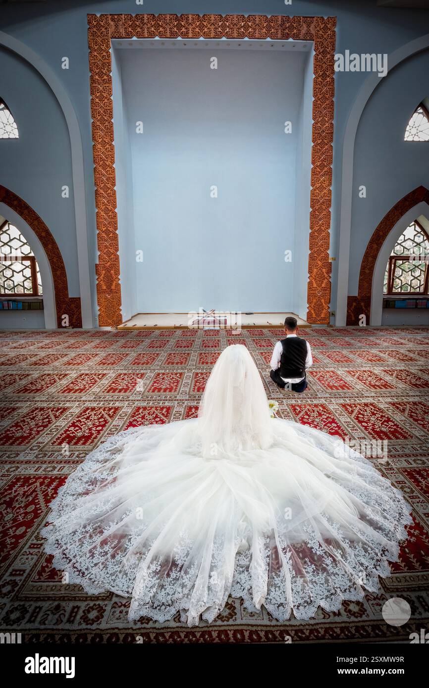 Islamic wedding day ceremony at mosque. Bride and groom sitting in ...